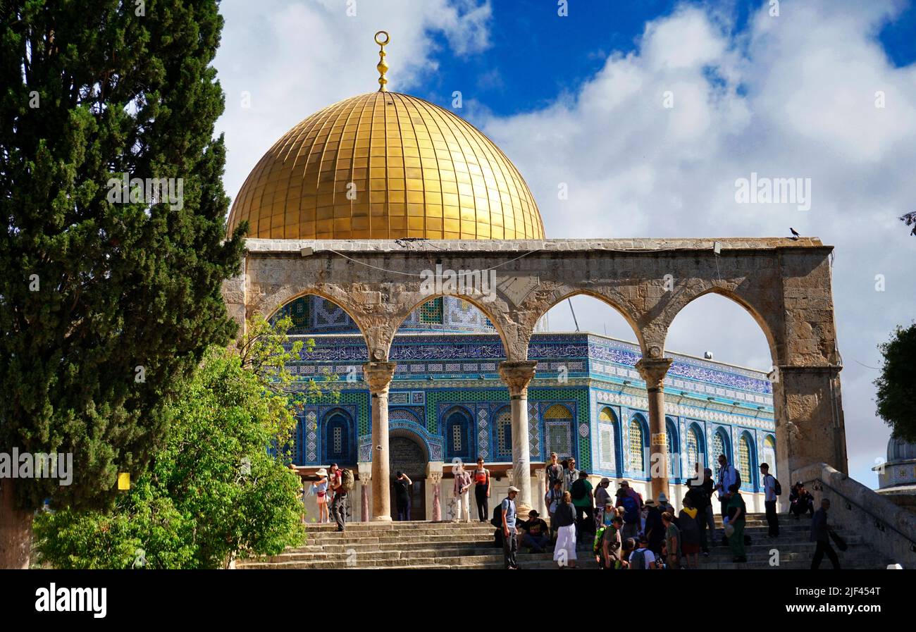Tourists visit The Dome of the Rock is an Islamic shrine in the Old ...