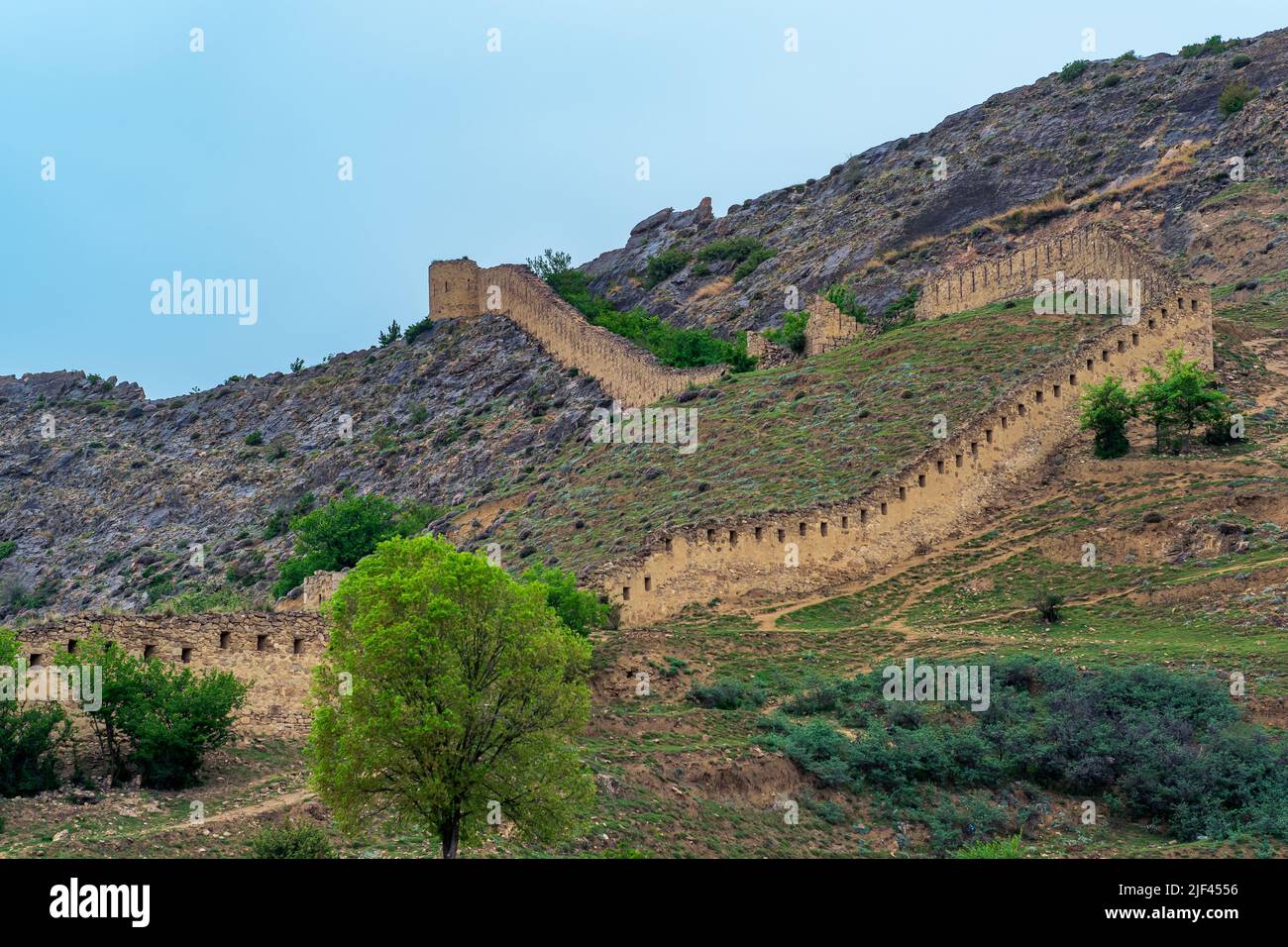 medieval fortress wall and tower on a mountain slope, Shamil (Gunib ...