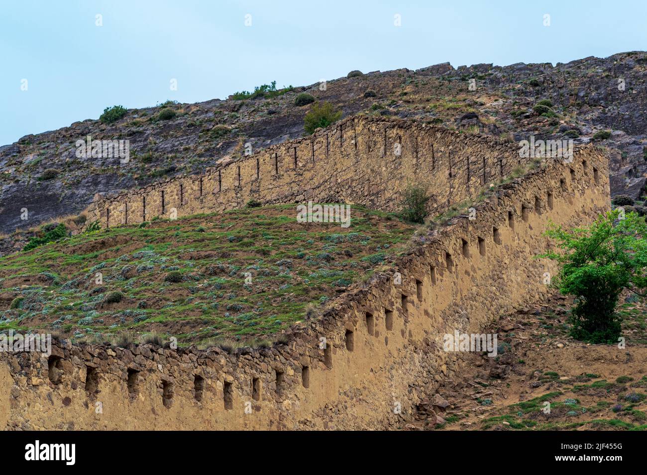 medieval fortress wall on a mountain slope, Shamil (Gunib) fortress in ...