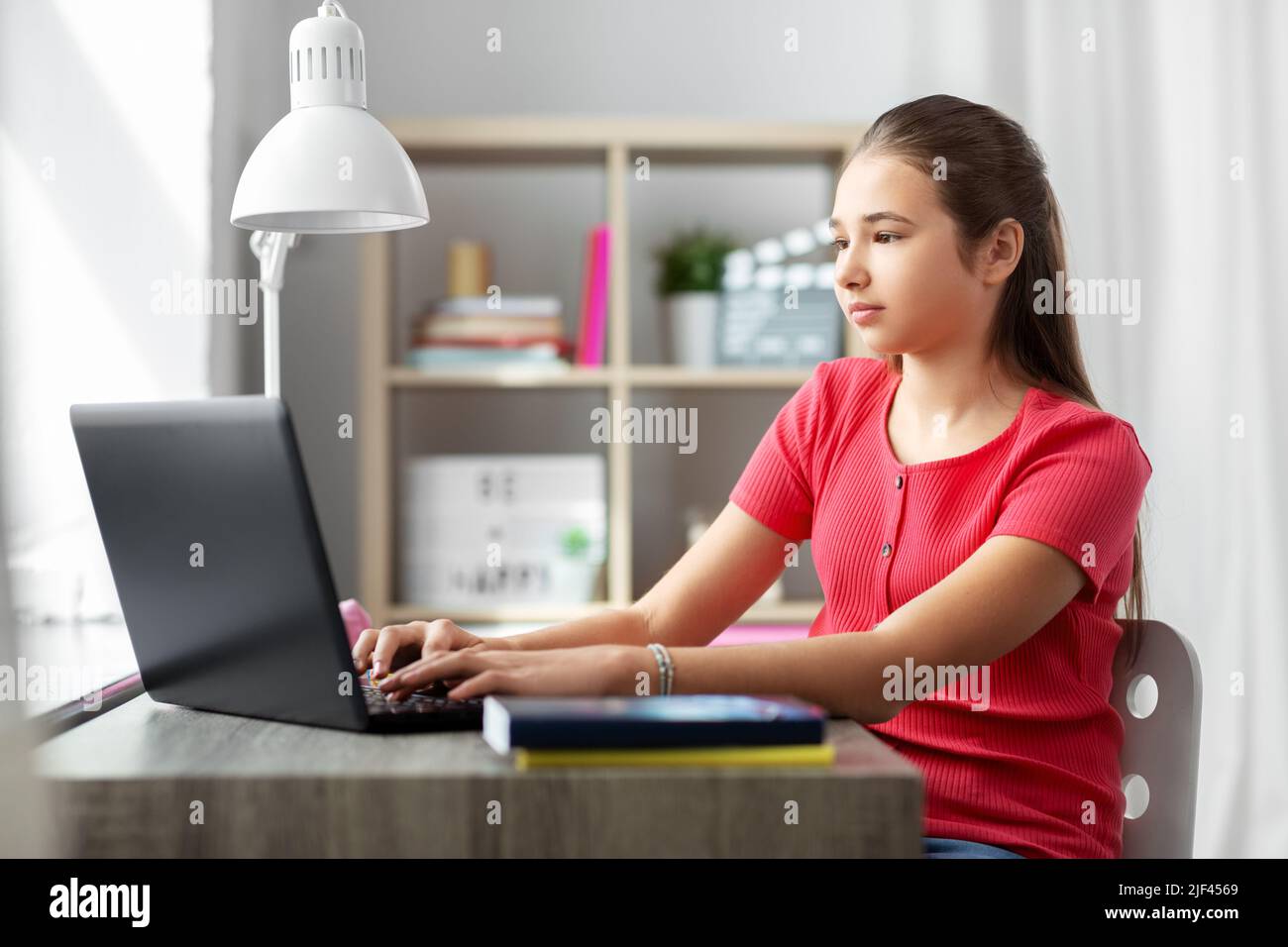 student girl with laptop computer learning at home Stock Photo - Alamy