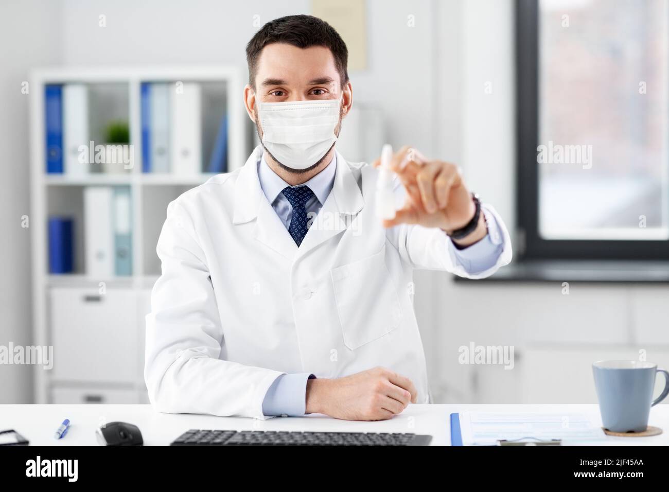 smiling male doctor with medicine at hospital Stock Photo - Alamy