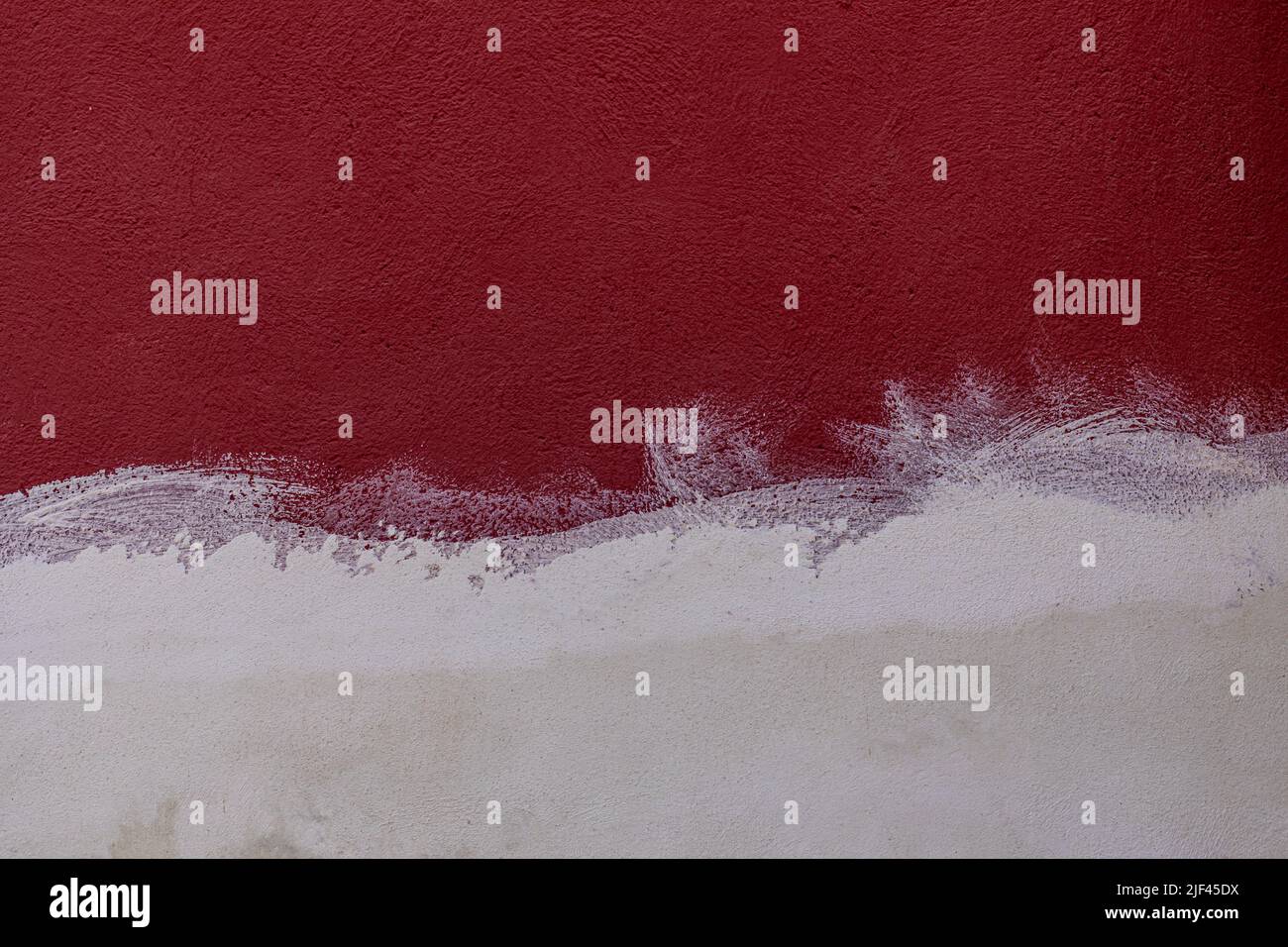 Maroon painted wall texture and half with white plaster plaster Stock ...