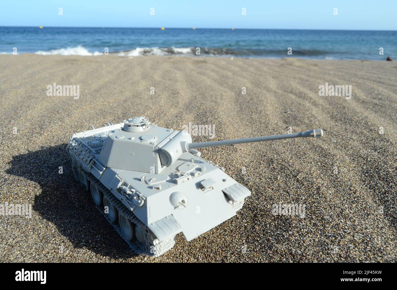 War Concept Gray Tank Model on the Beach Stock Photo - Alamy
