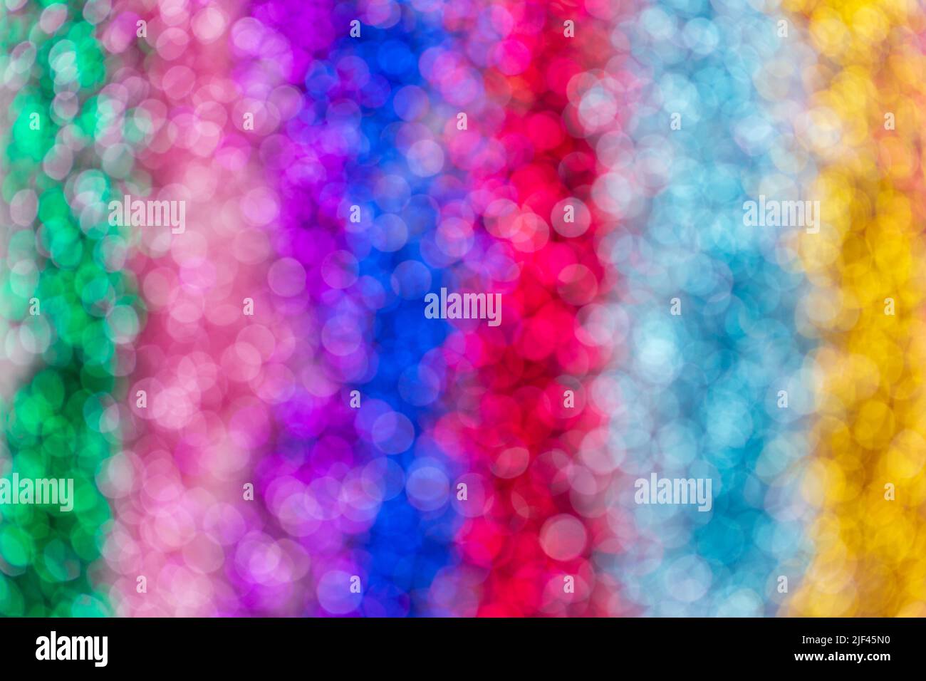 multicolored glitters or sequins bokeh background Stock Photo - Alamy