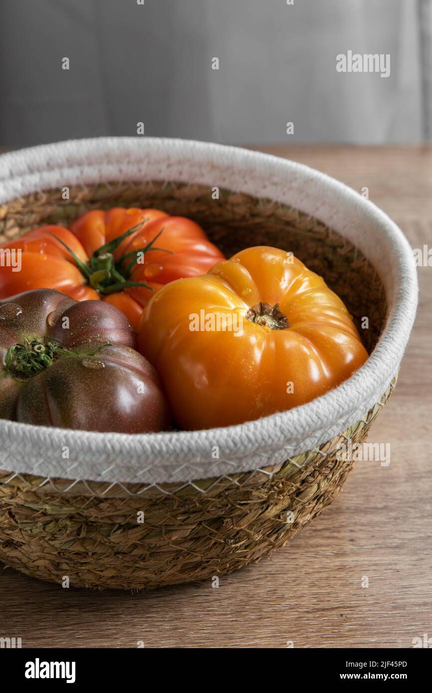 Beefsteak tomatoes in a basket Stock Photo - Alamy