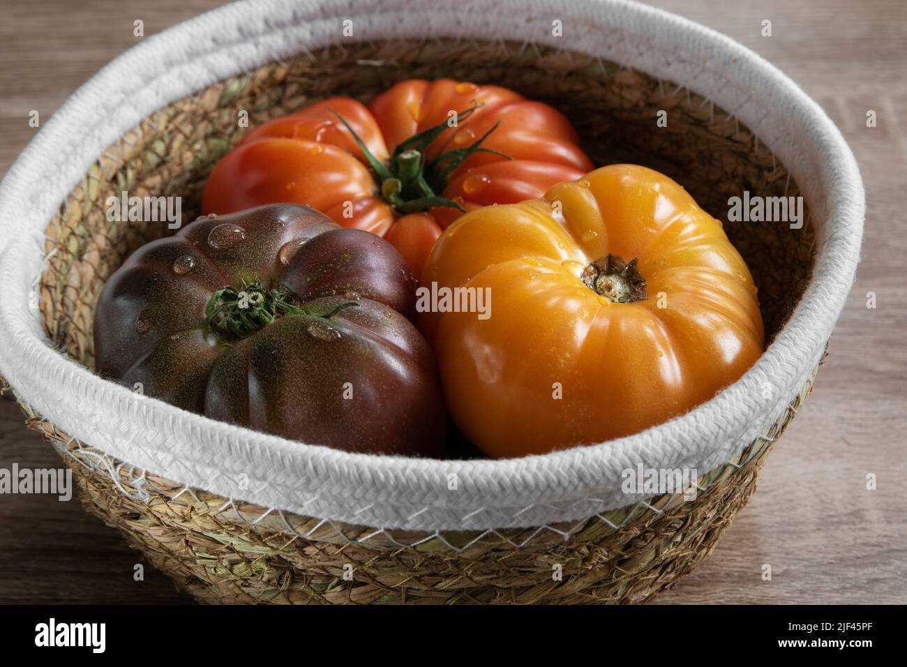 Beefsteak tomatoes in a basket Stock Photo - Alamy