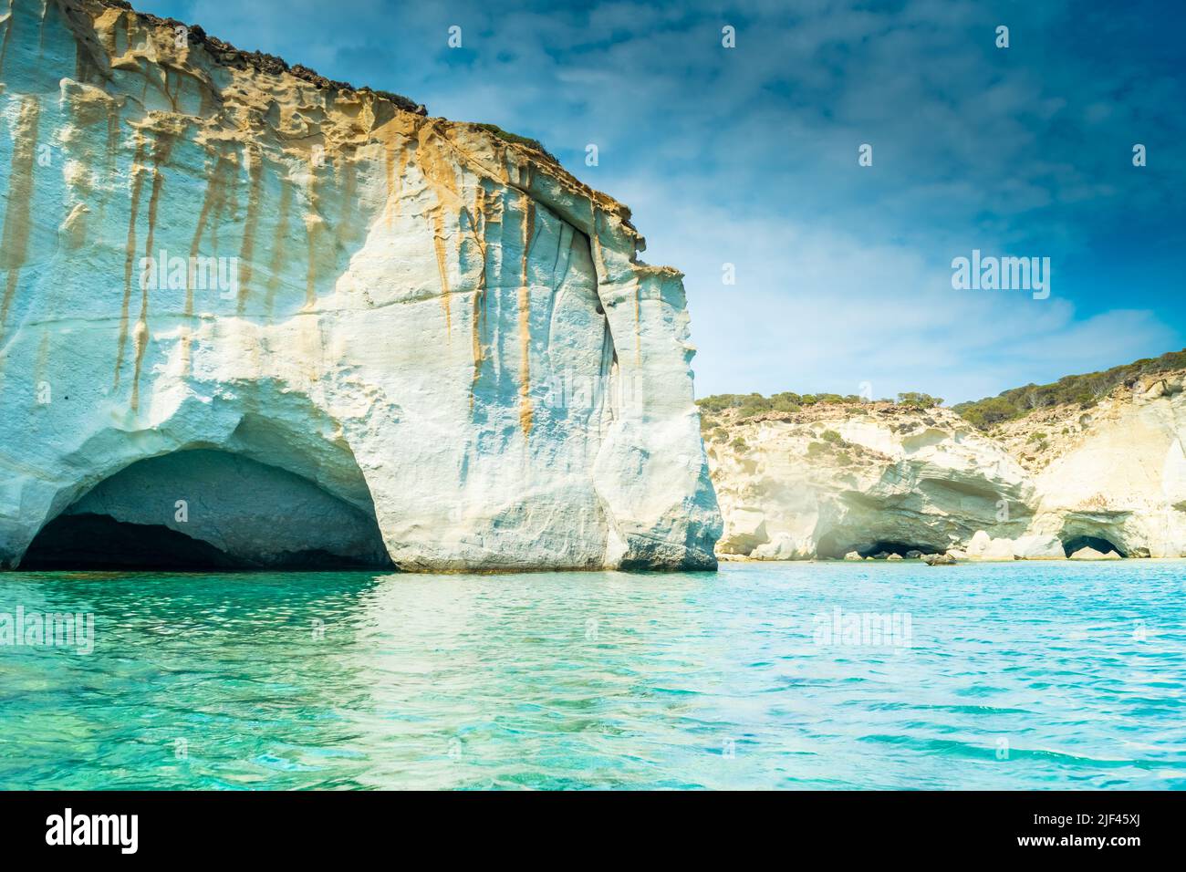 Amazing white cliffs and crystal clear water in Kleftiko Bay, Milos ...