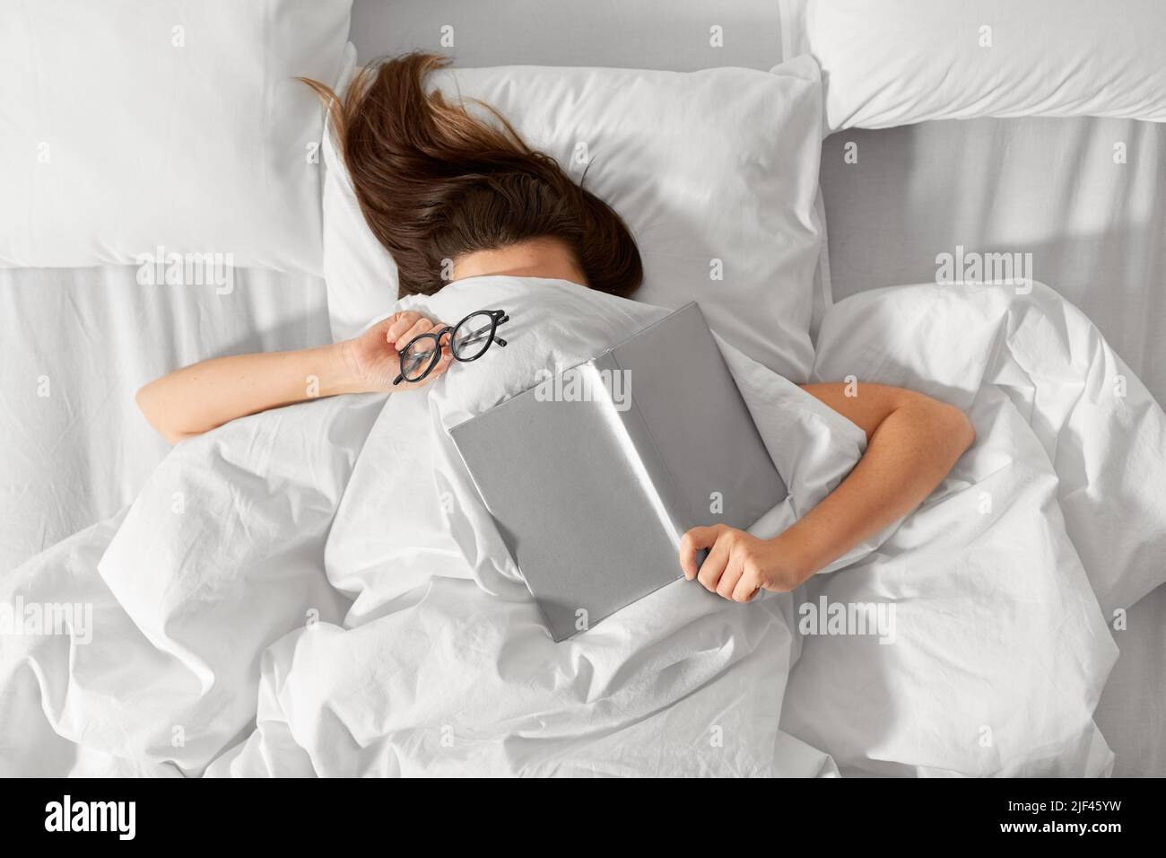 Woman sleeping book in hi-res stock photography and images - Alamy