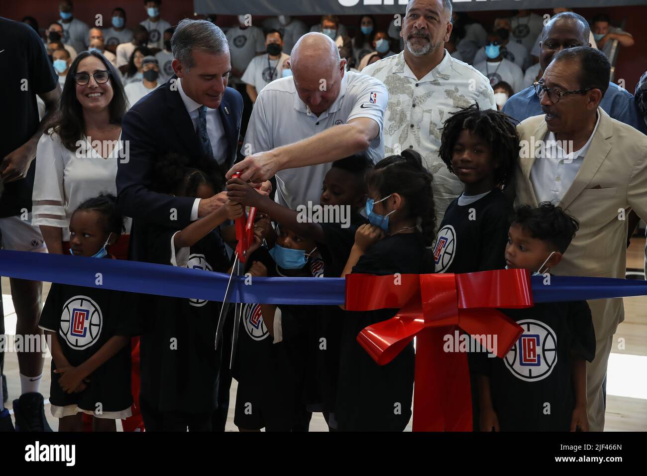 Eric Garcetti alongside Steve Ballmer cut the ribbon with the kids ...