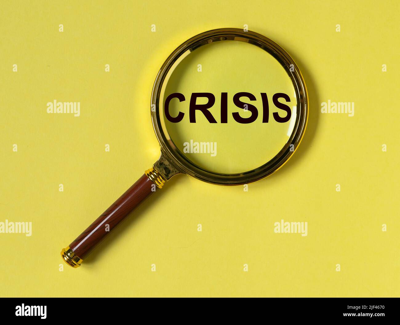 Crisis word. Abstract crisis analysis through magnifying lens. High ...