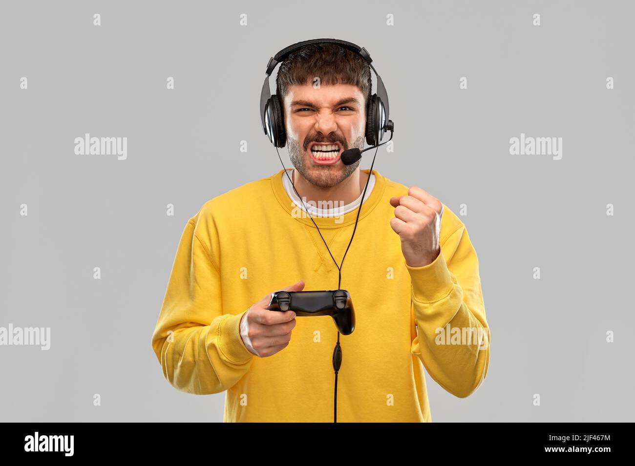 Gamer guy headphones playing video hi-res stock photography and images ...