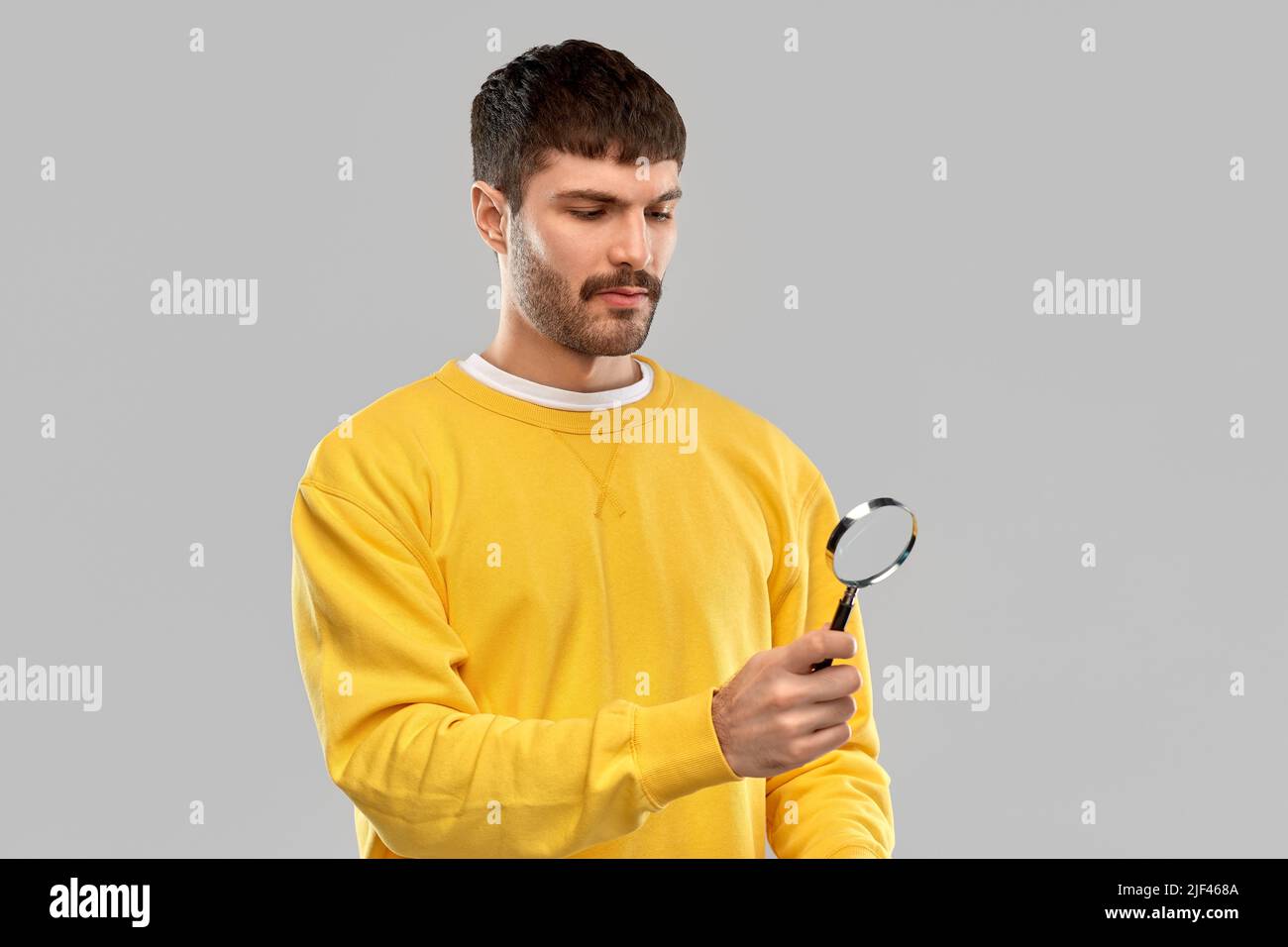 Man magnifier hi-res stock photography and images - Alamy