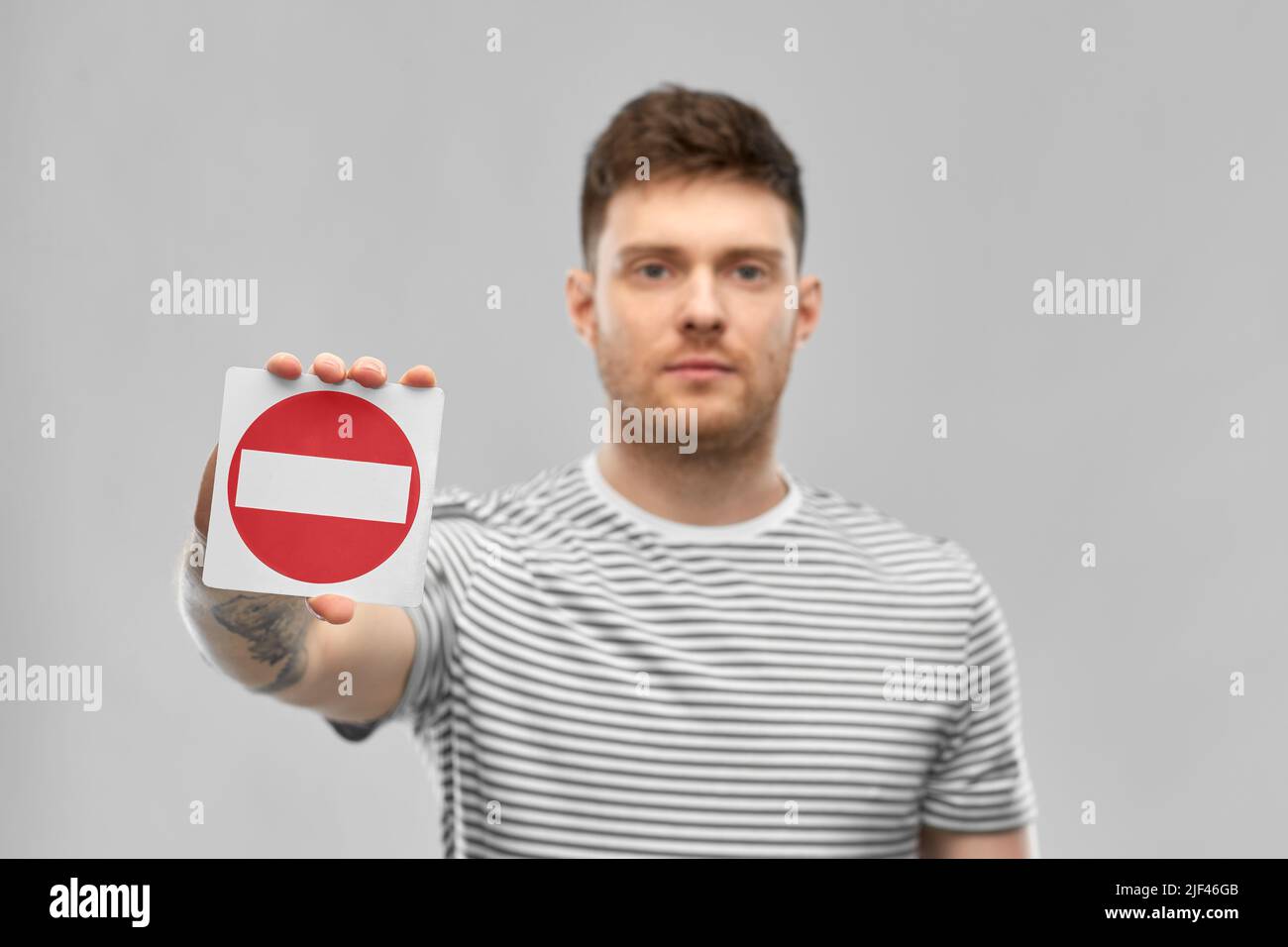 young man showing stop sign Stock Photo - Alamy