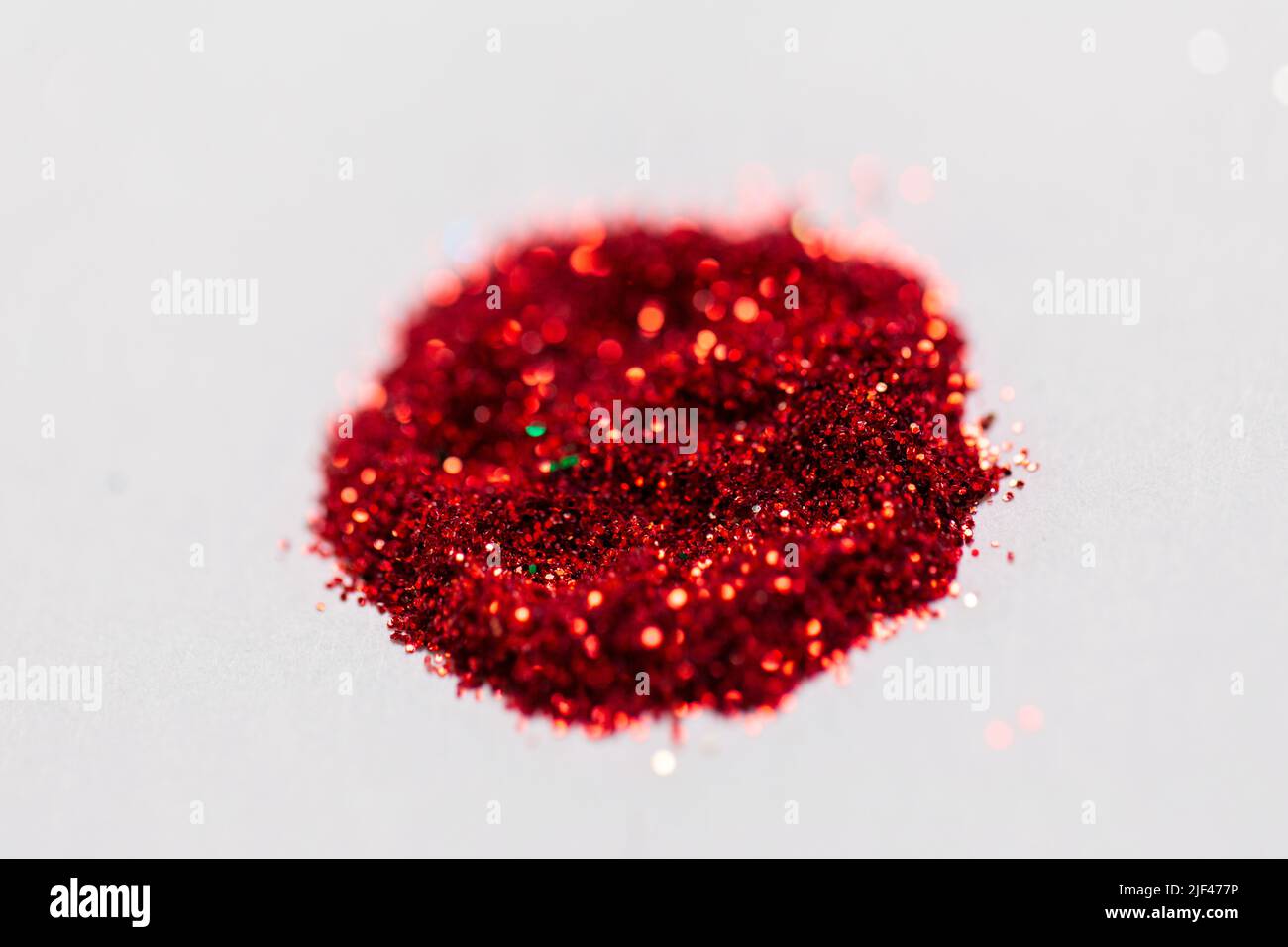 red glitters on white background Stock Photo - Alamy