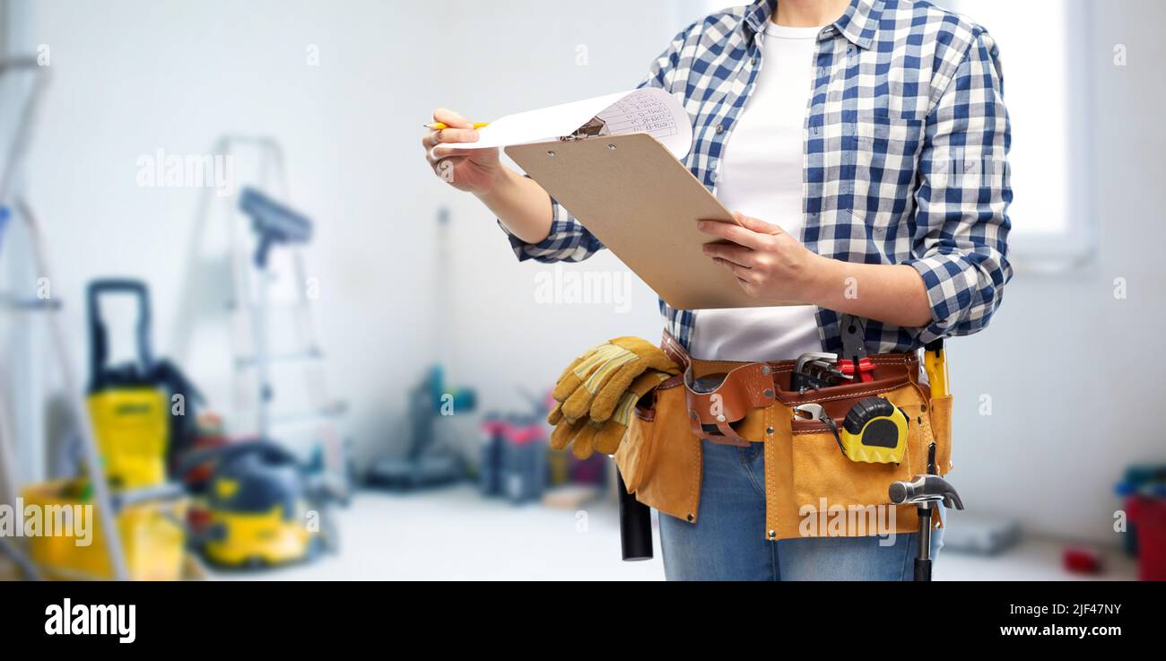 woman with clipboard, pencil and working tools Stock Photo - Alamy