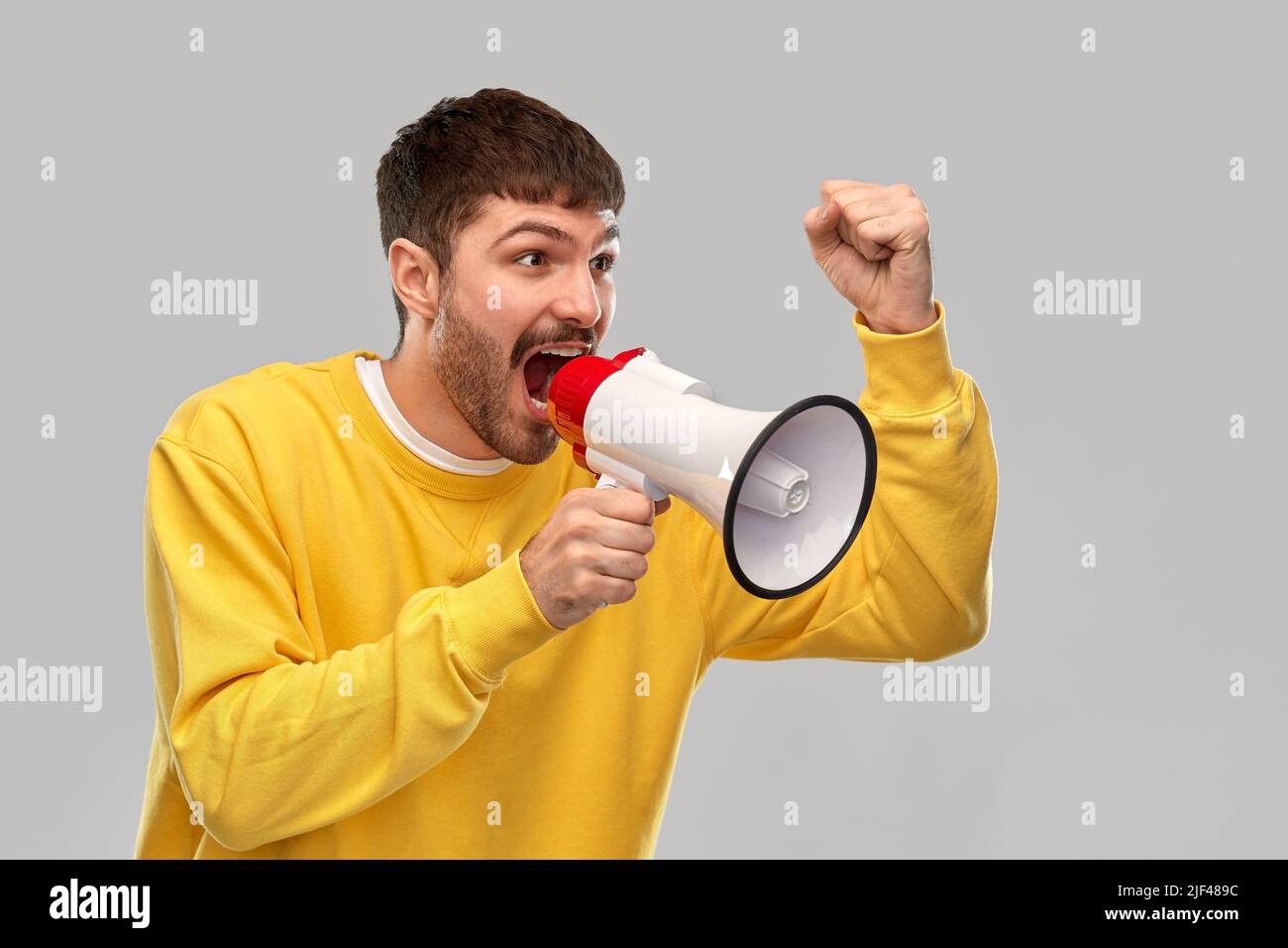 angry man shouting to megaphone Stock Photo - Alamy