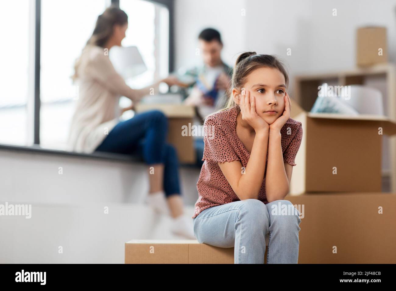 sad girl moving to new home with her family Stock Photo - Alamy