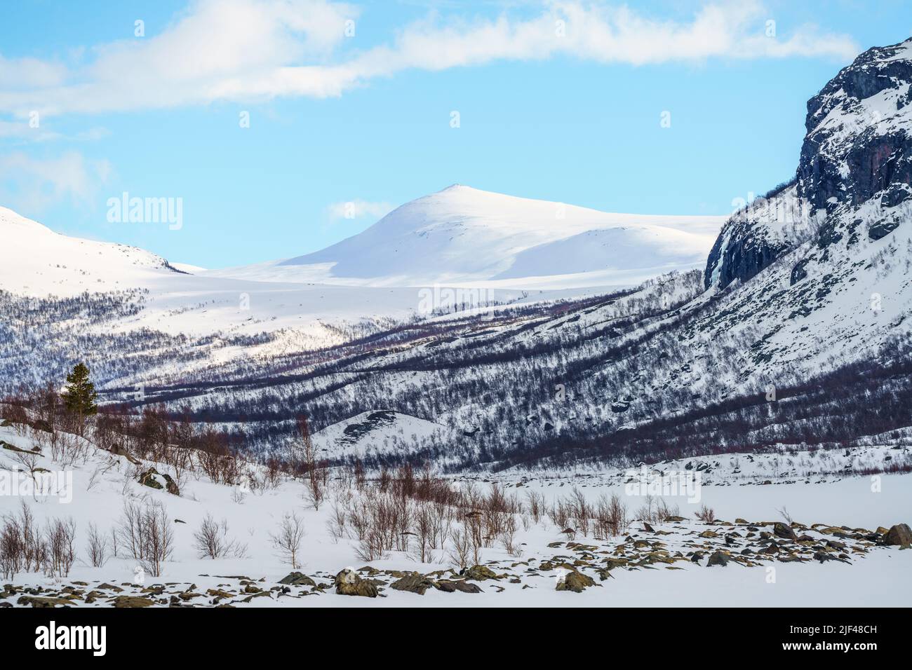Winter landscape with high mountains with snow and sunny weather in ...