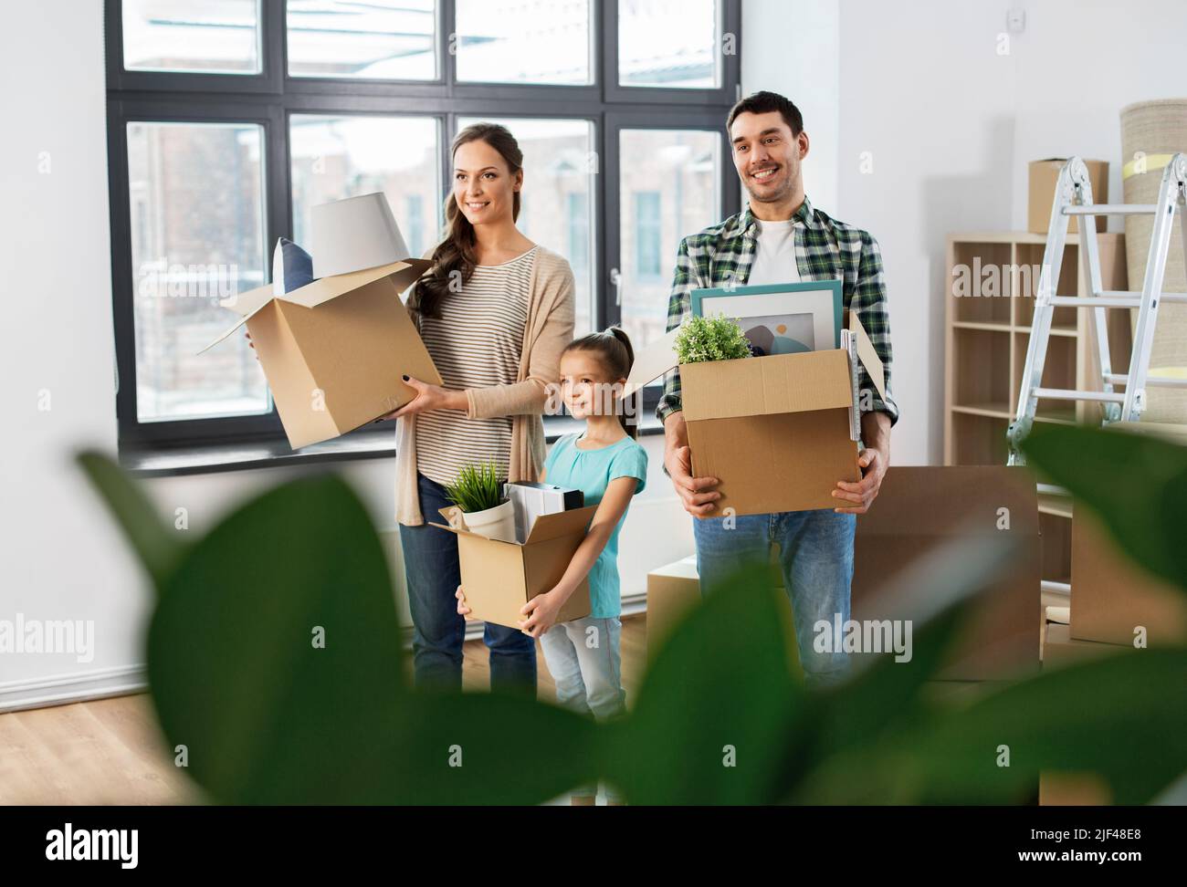 happy family with child moving to new home Stock Photo - Alamy