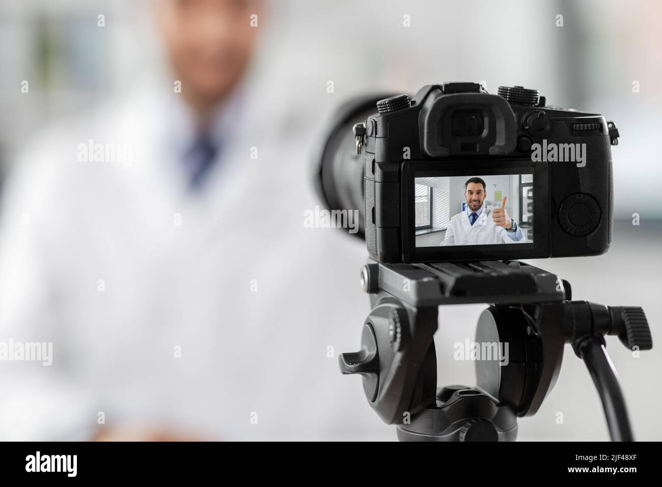 male doctor recording video blog at hospital Stock Photo - Alamy