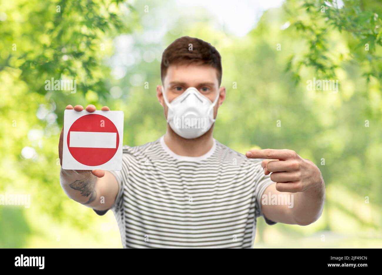 man in respirator mask showing stop sign Stock Photo - Alamy