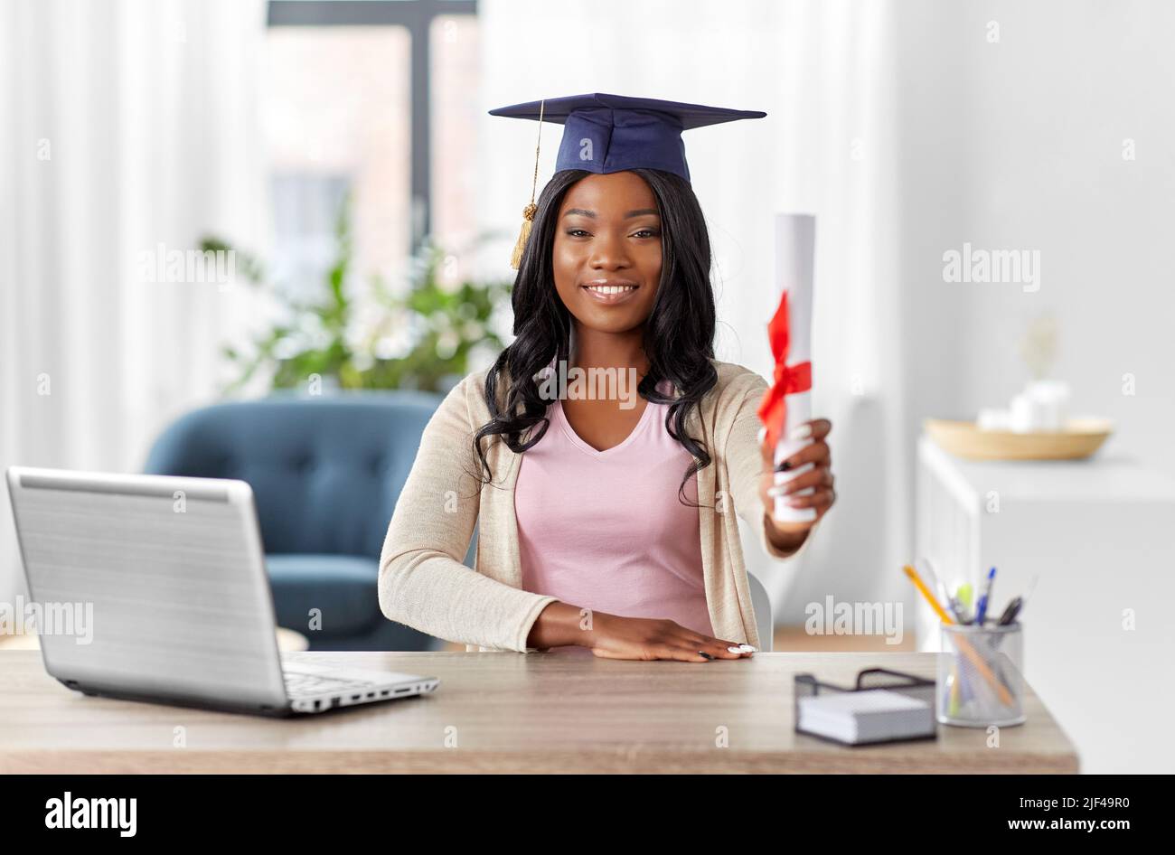Happy graduate student diploma sitting hi-res stock photography and ...