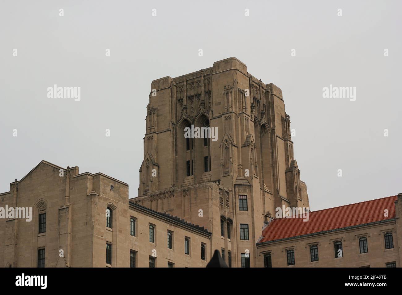 A gigantic and elaborate Gothic stone tower with medieval influences ...