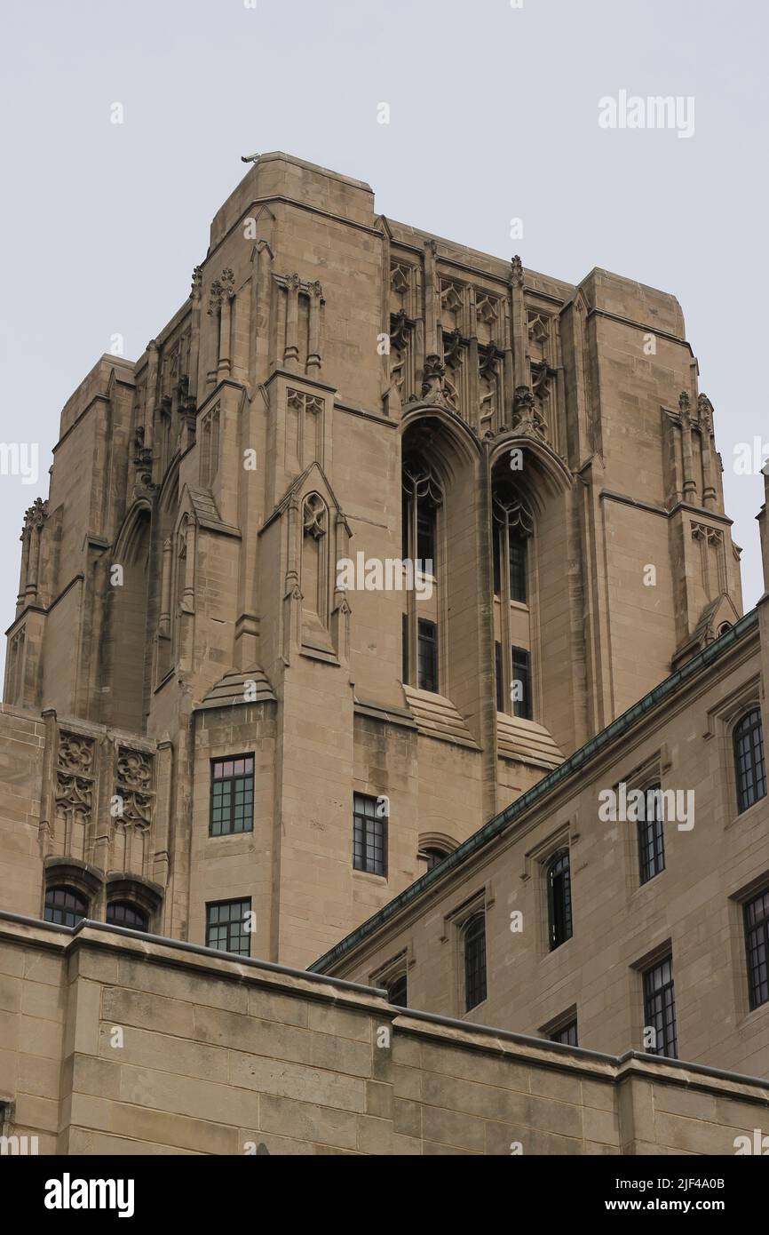 A gigantic and elaborate Gothic stone tower with medieval influences ...