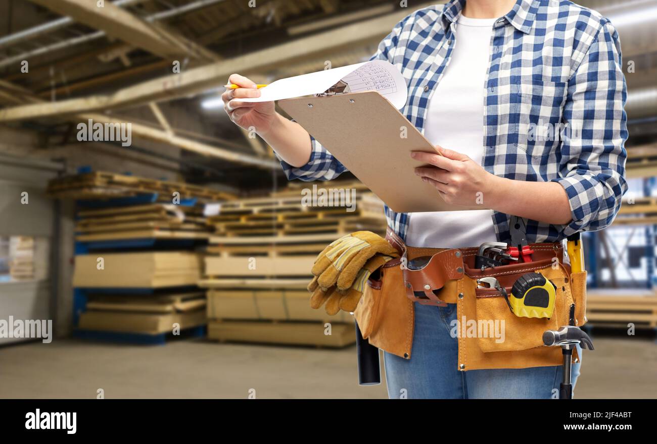 female worker with clipboard and working tools Stock Photo - Alamy