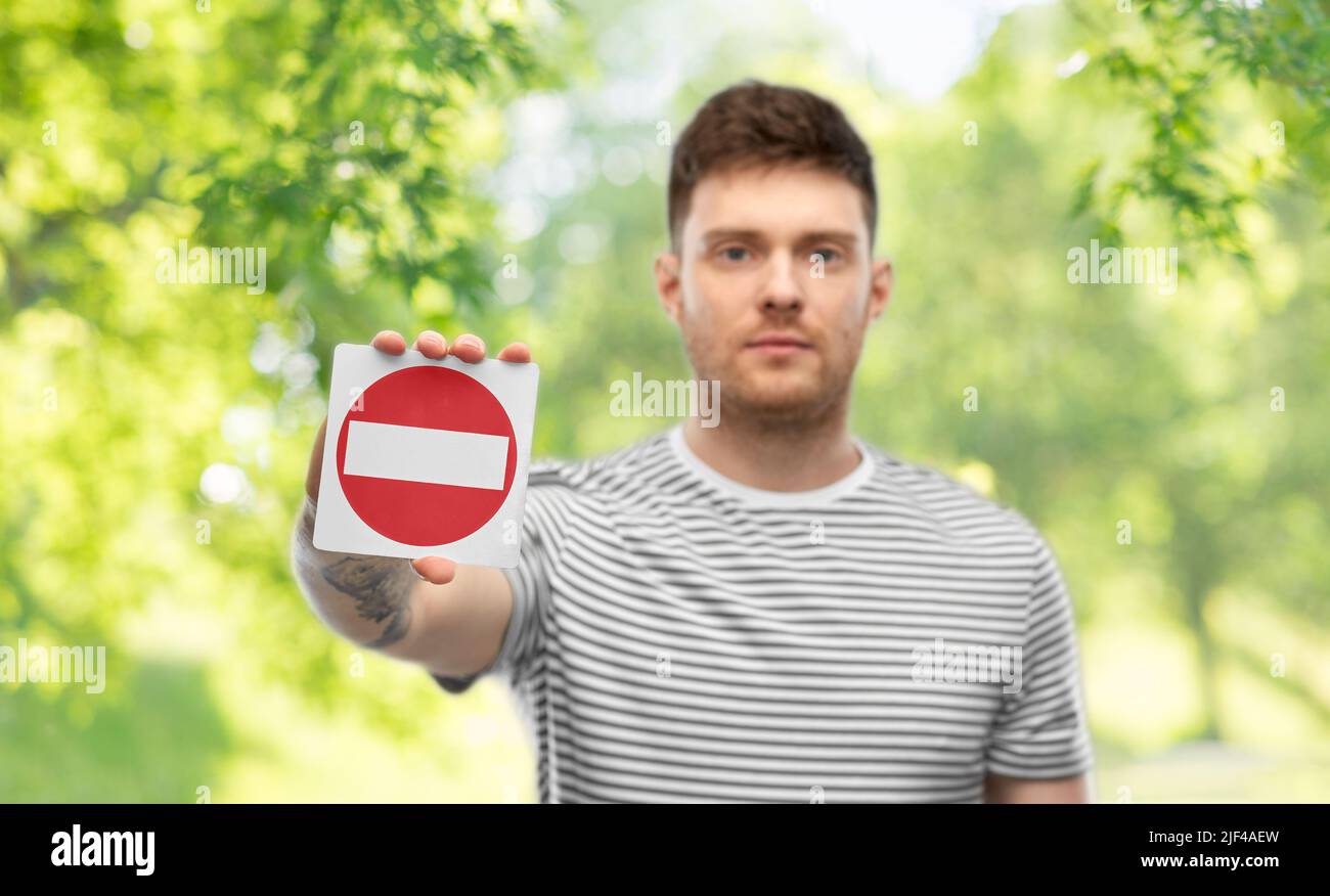 young man showing stop sign Stock Photo - Alamy