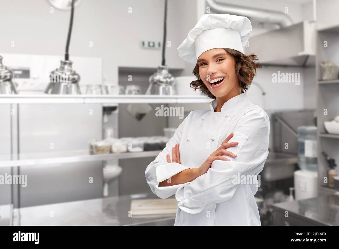 Happy female chef arms crossed hi-res stock photography and images - Alamy