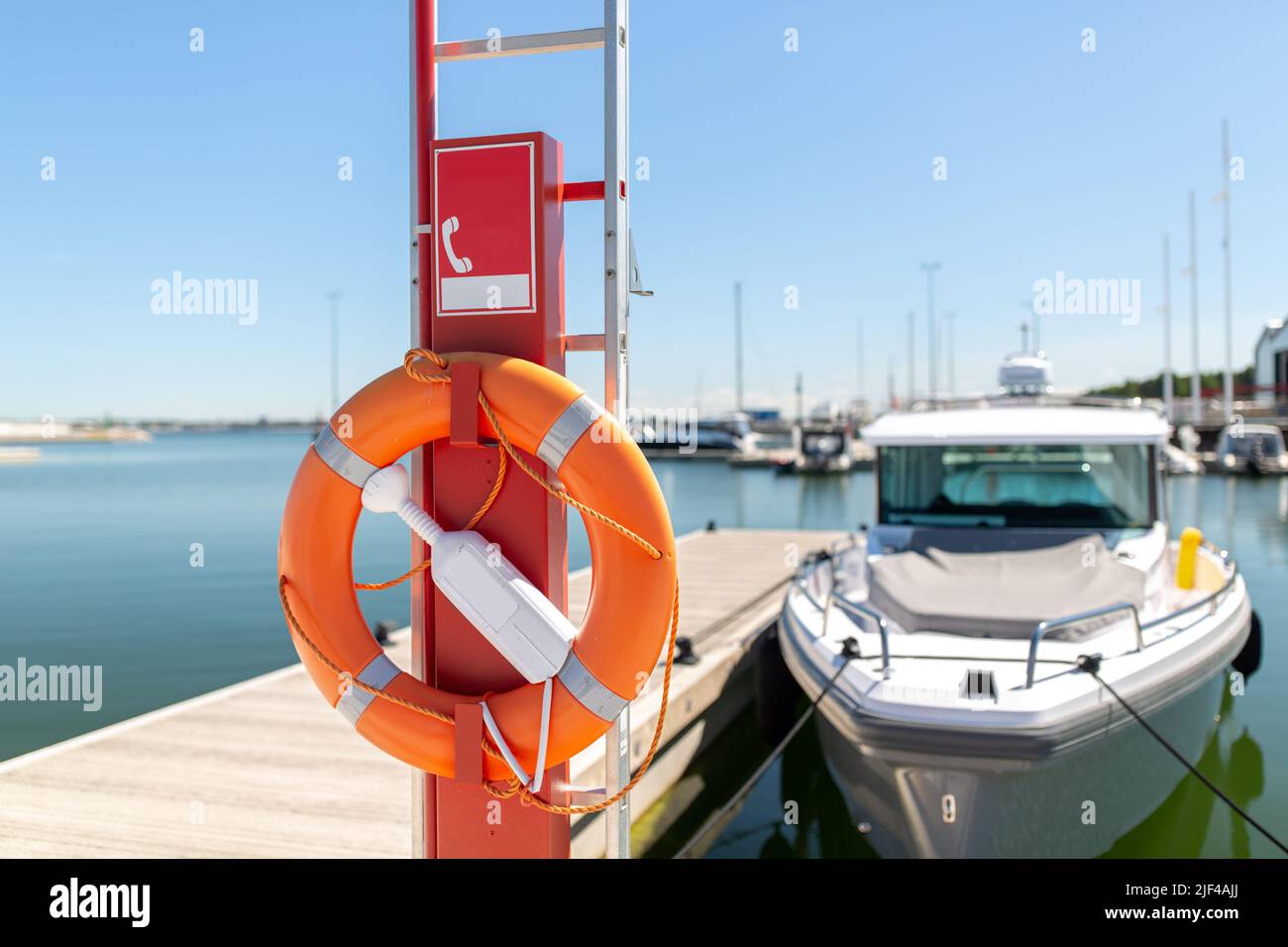 life ring or lifebuoy hanging on post at sea berth Stock Photo - Alamy