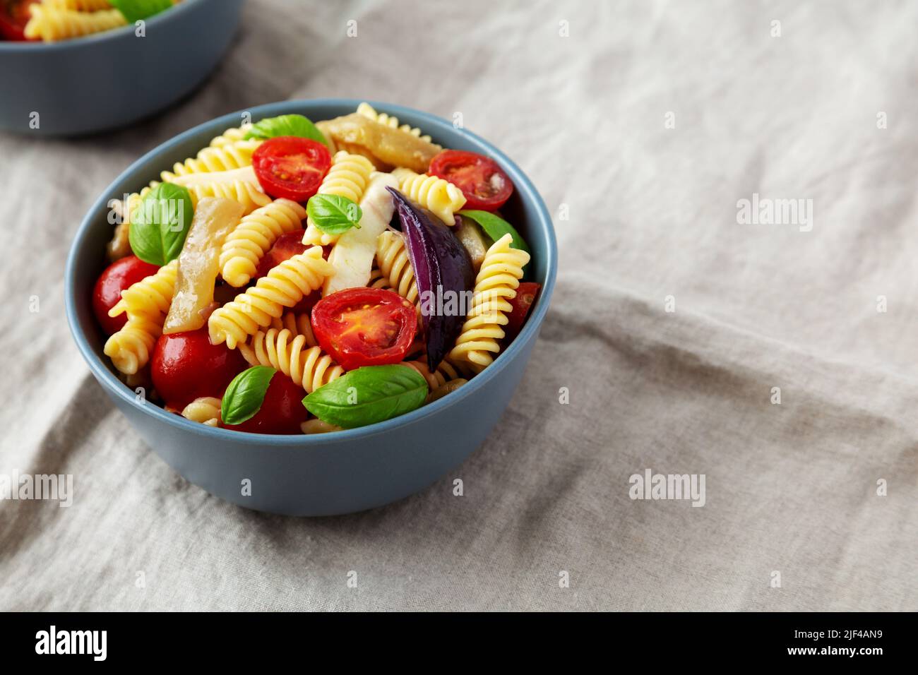 Homemade Fusilli Pasta Salad with Mozzarella and Vegetables, side view ...