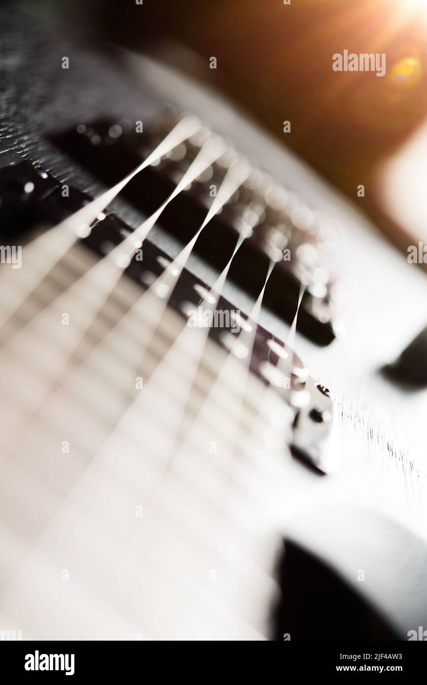 close up black electric guitar on black background Stock Photo - Alamy