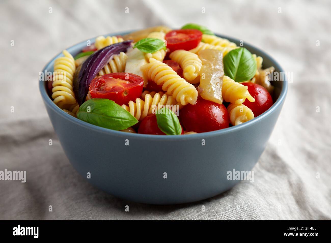 Homemade Fusilli Pasta Salad with Mozzarella and Vegetables, side view ...
