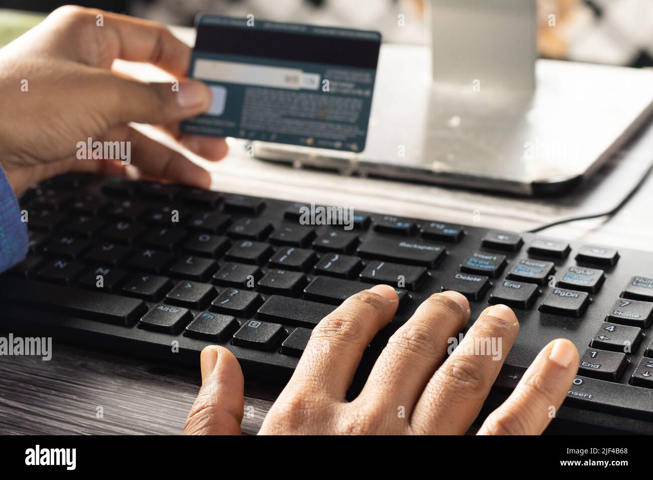 Selective focus on an Indian male hand using credit or debit card in ...