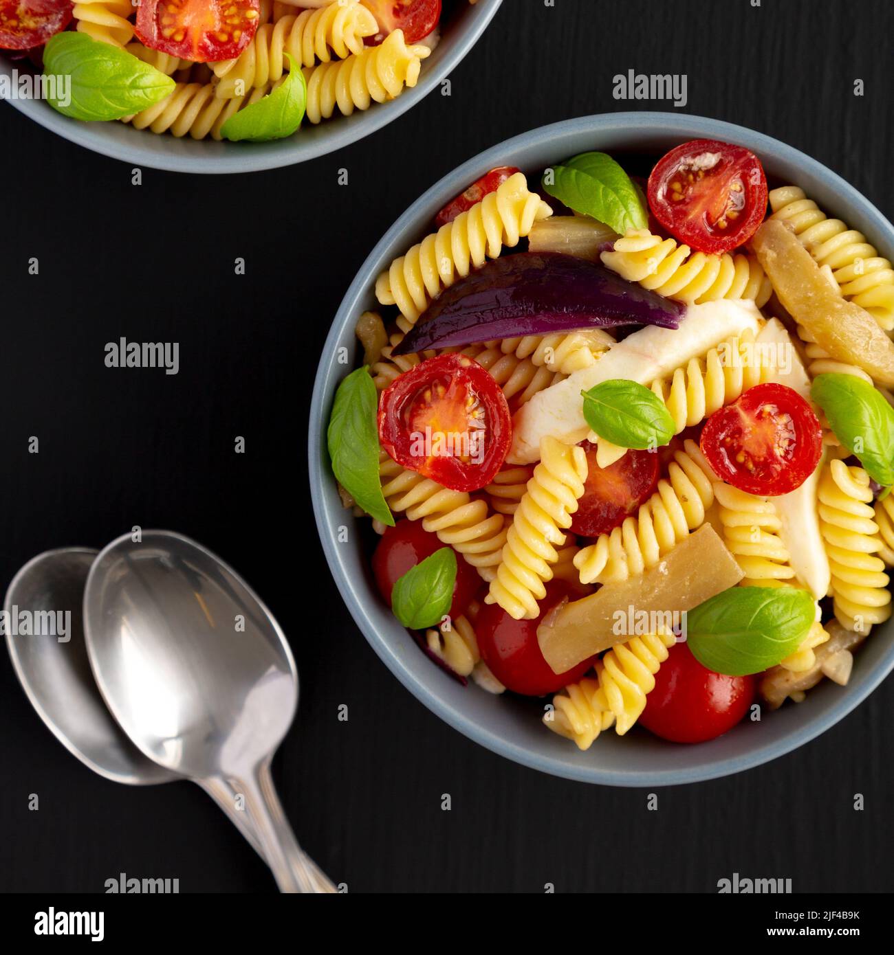 Homemade Fusilli Pasta Salad with Mozzarella and Vegetables in a Bowl ...