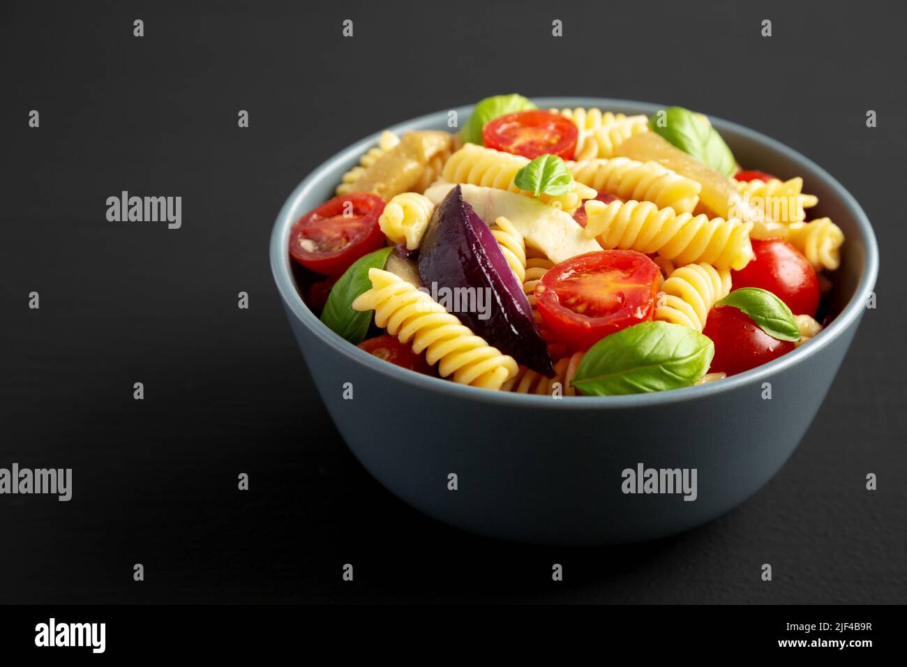 Homemade Fusilli Pasta Salad with Mozzarella and Vegetables in a Bowl ...