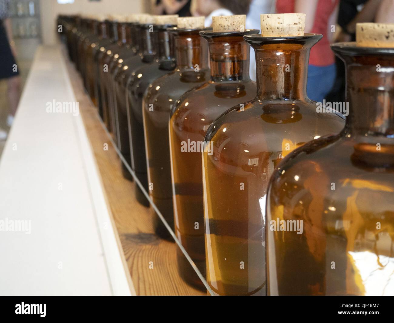 many essence parfume old bottles in factory detail Stock Photo - Alamy