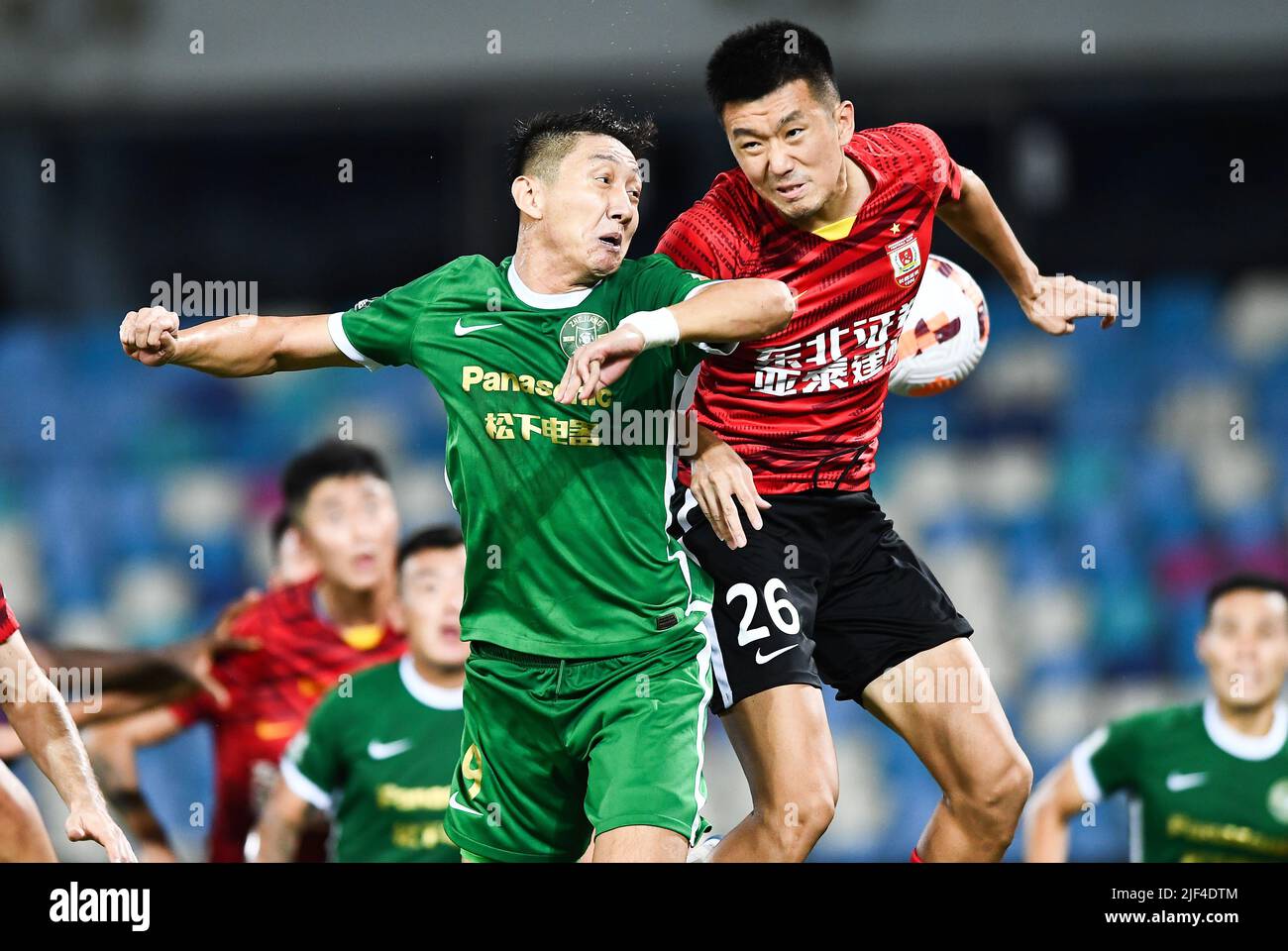 Haikou, China's Hainan Province. 29th June, 2022. Dong Honglin (R) of Changchun Yatai vies with ...