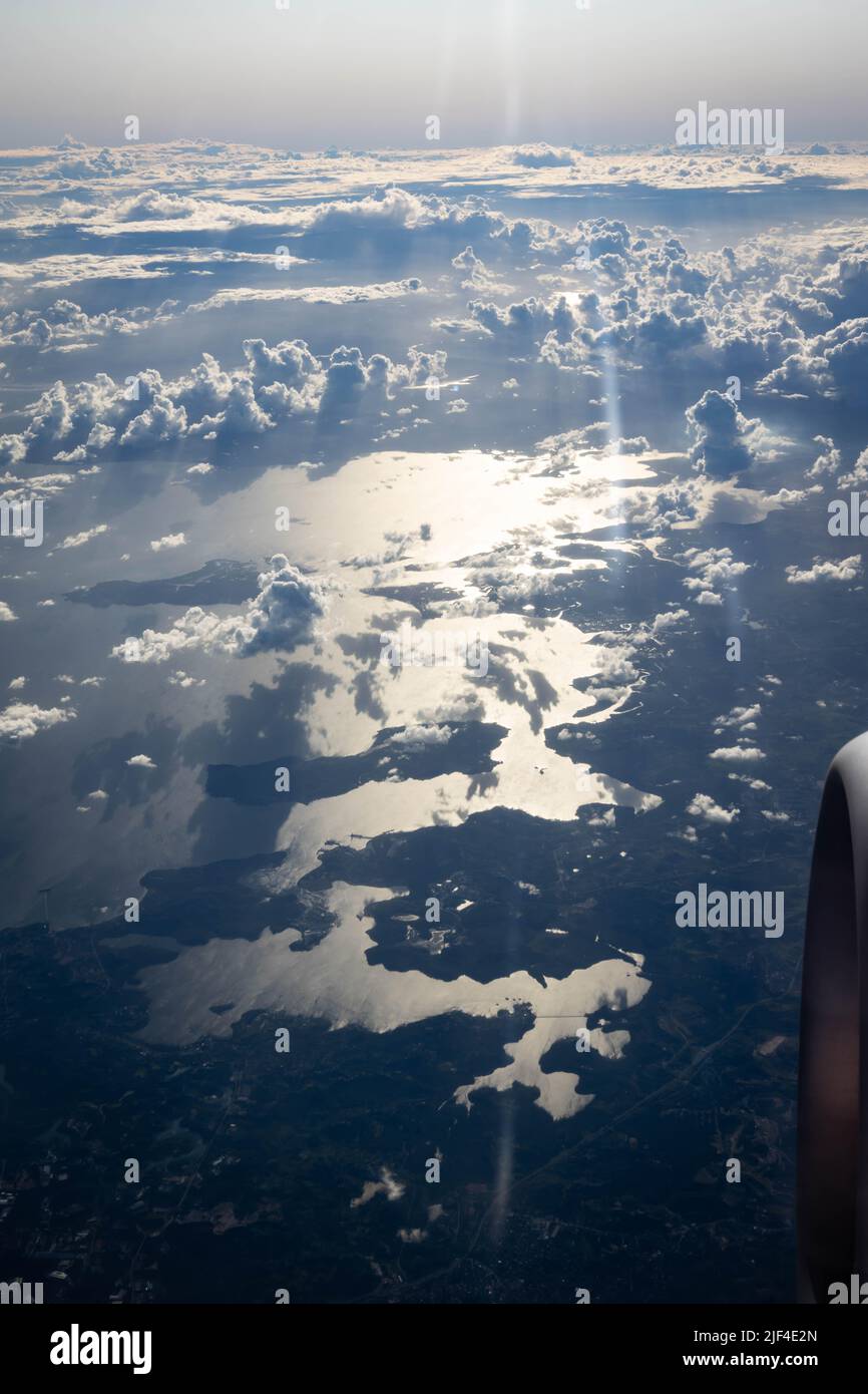 Rays of the sun passing through the clouds at sunset. Aerial view of ...