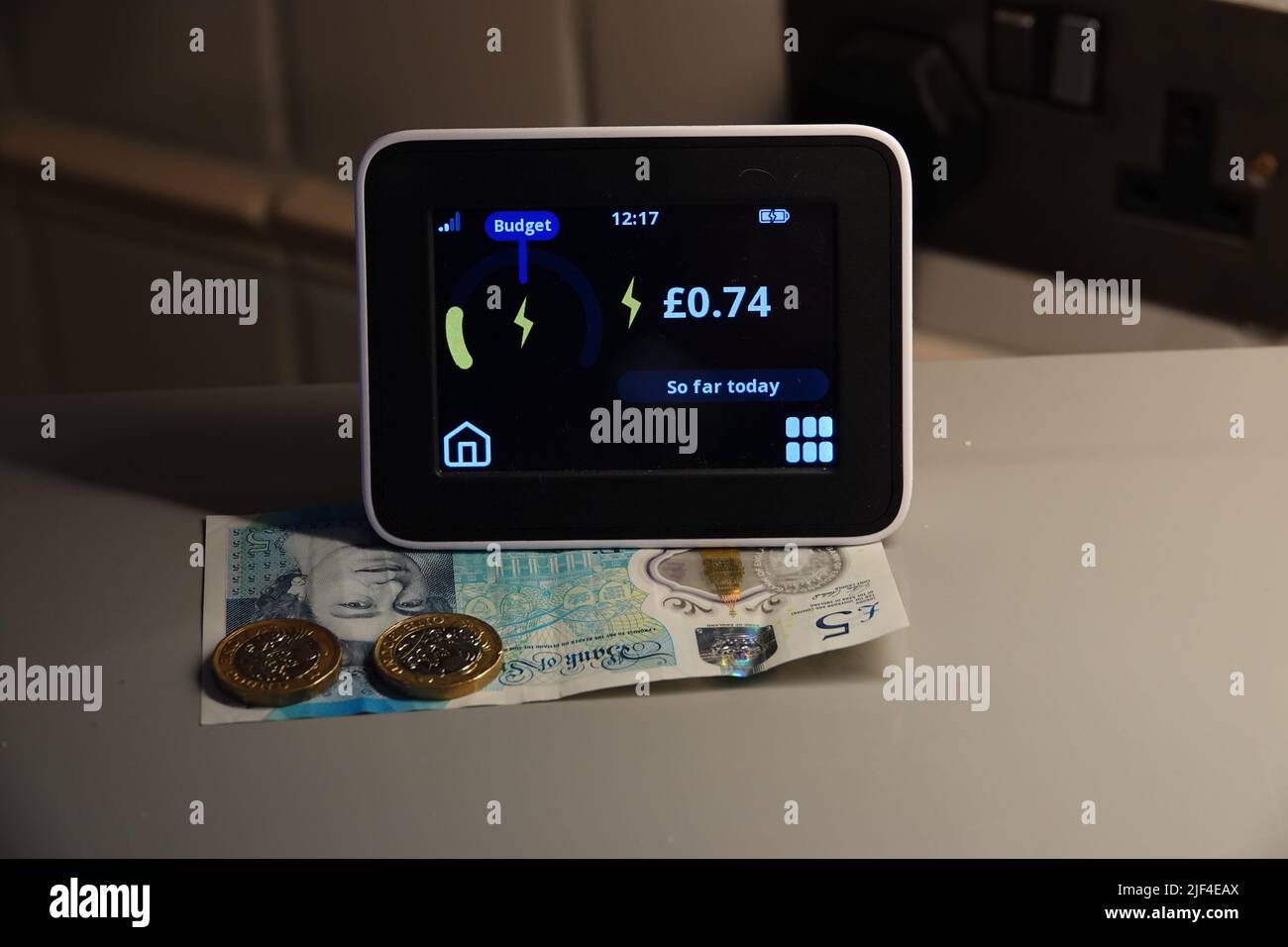 An electricity smart-meter, with plug socket, checking electricity ...