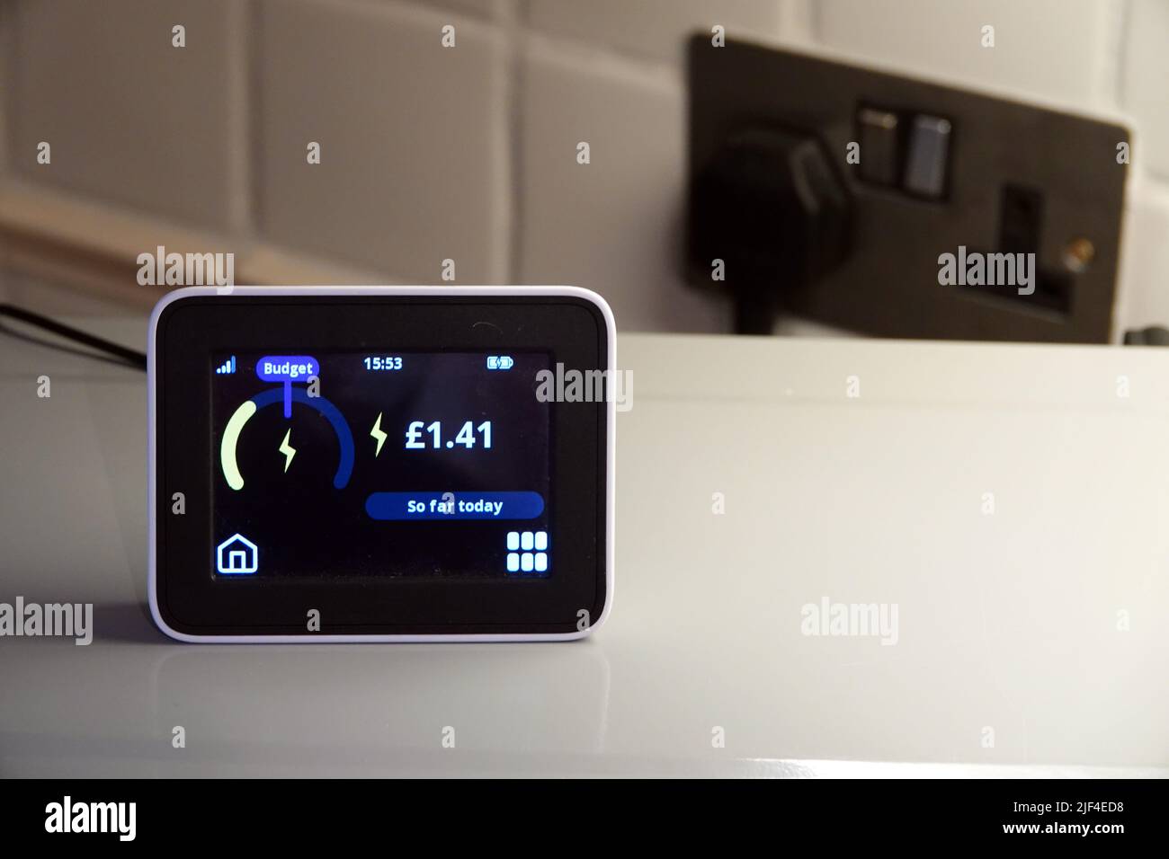 An electricity smart-meter, with plug socket, checking electricity ...