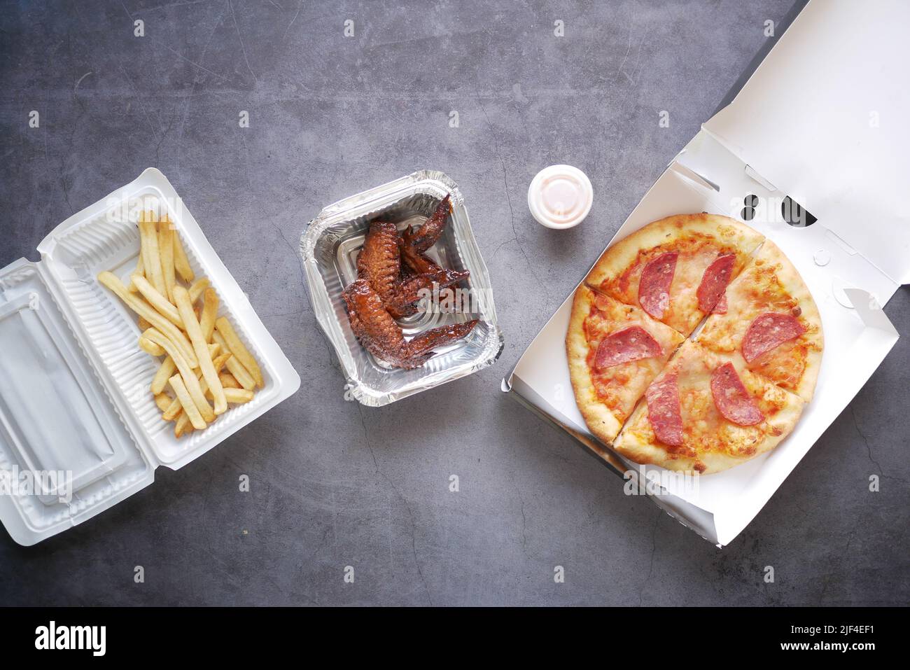 junk foods on a take away box on table Stock Photo - Alamy