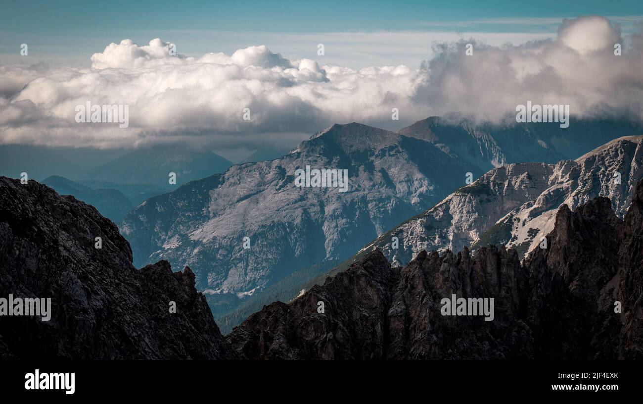 The beautiful view of the rocky mountain range and white clouds in the ...