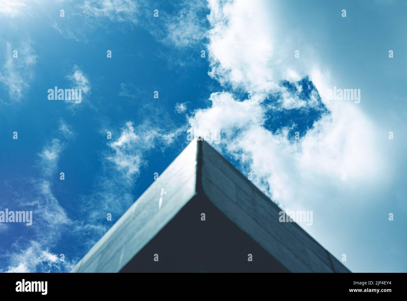 The sharp roof angle against the blue sky with white clouds Stock Photo ...