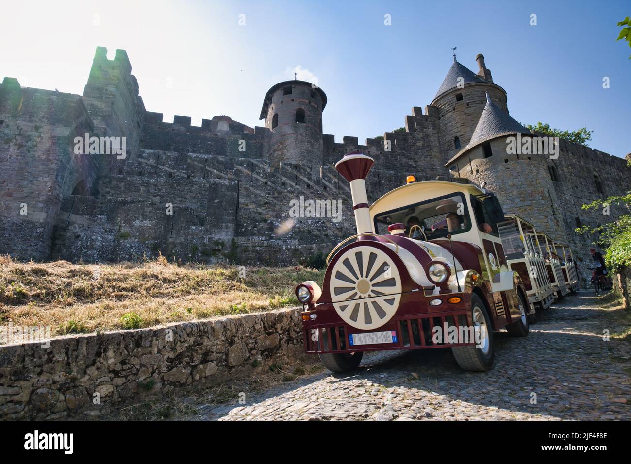Touristic train in front of the medieval castle in Carcassonne Stock ...