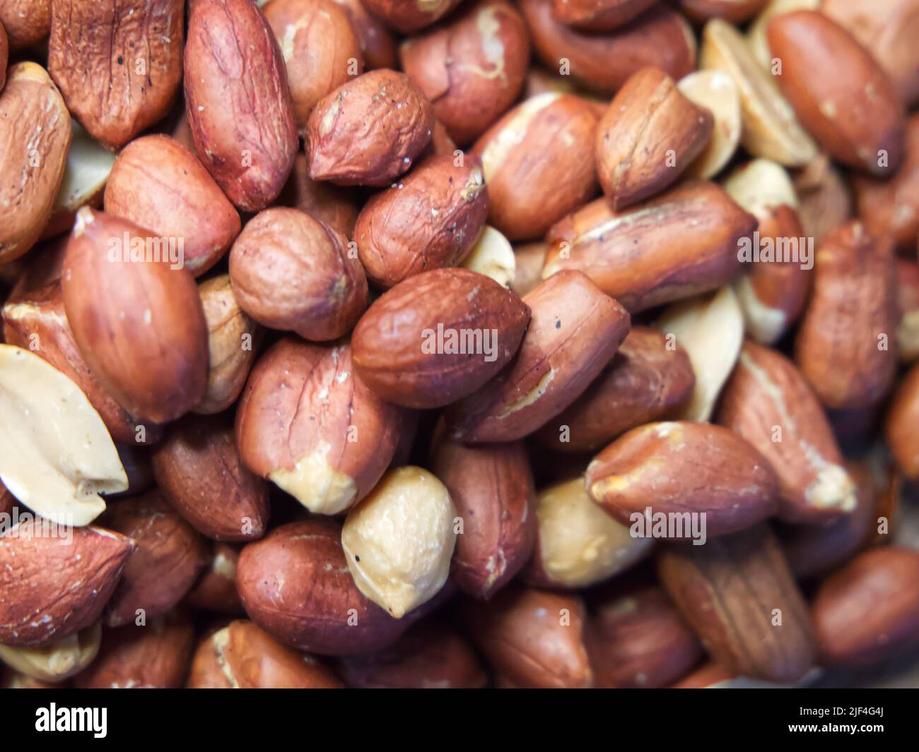 Roasted unpeeled peanuts macro, peanuts as a background. Peanut ...