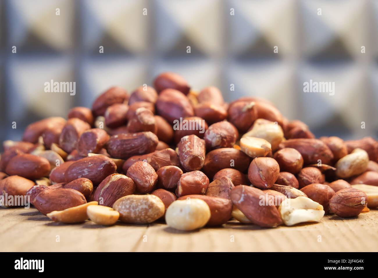 Heap of roasted peanuts, side view. Peanuts close up. Nuts. Peanuts ...