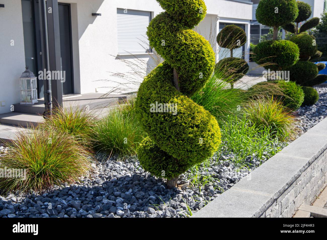 Modern and well-kept front garden with exceptionally beautiful planting ...
